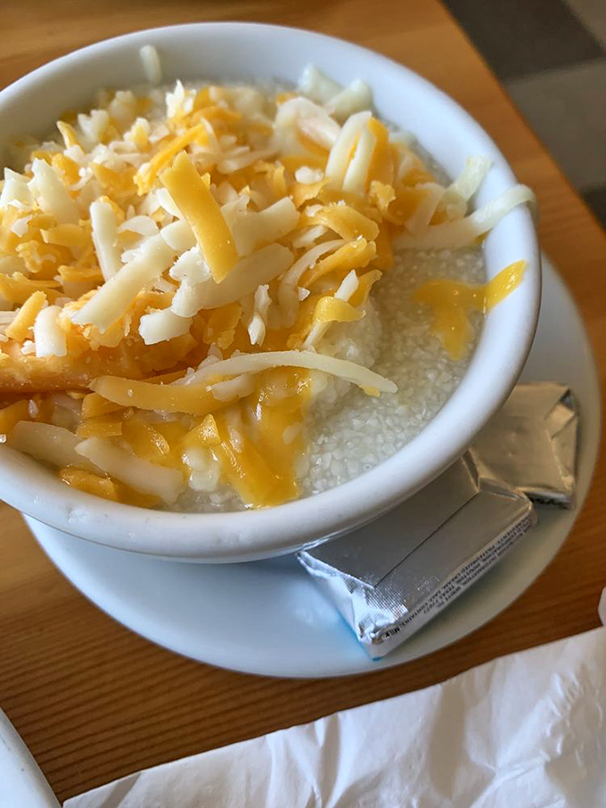 Creamy grits topped with a snowfall of shredded cheese &ndash; Southern comfort that somehow found its way to Studio City and decided to stay.
