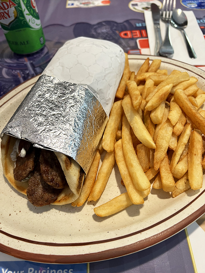 The gyro wrap&mdash;where seasoned meat meets warm pita in a foil-wrapped romance. Those fries aren't just a side; they're supporting characters in this Mediterranean drama.