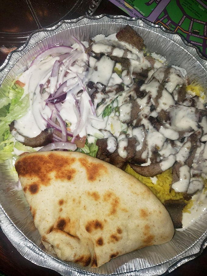 The gyro plate arrives like a deconstructed Mediterranean dream&mdash;meat sliced thin as poetry, tzatziki white as Santorini walls, and vegetables bright as Aegean waters.