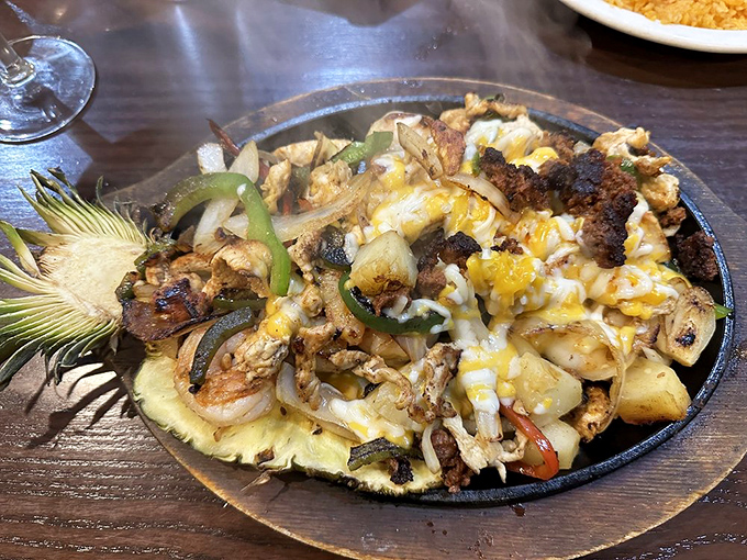 Sizzling Hawaiian fajitas arrive like a tropical fiesta on cast iron. That pineapple slice isn't just garnish&mdash;it's announcing the party has officially started.