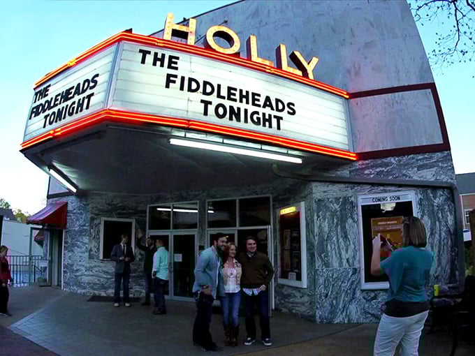 The Holly Theatre's vintage marquee lights up downtown evenings, proving small towns know how to put on a show without Broadway's ticket prices.