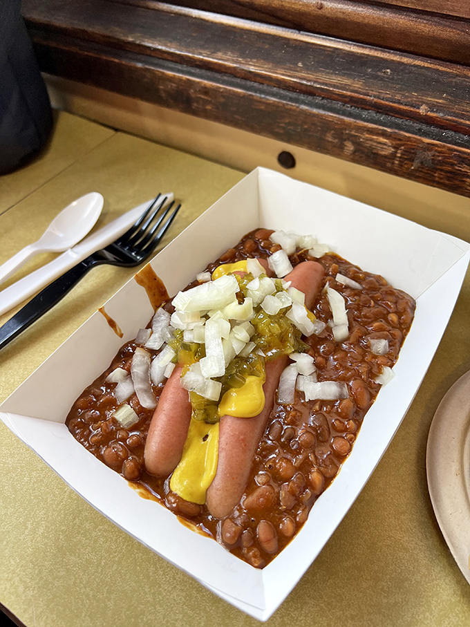 Beans & Dogs: where hot dogs go swimming in a sea of homestyle baked beans, topped with diced onions and a squiggle of mustard.