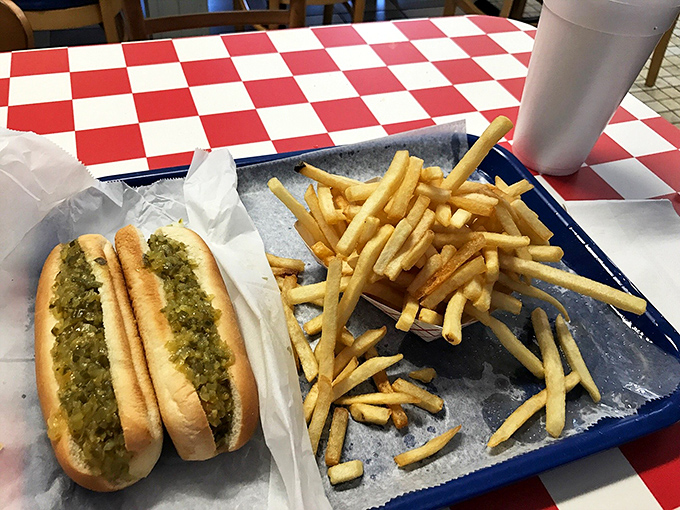 Hot dog artistry meets french fry perfection. The relish-to-bun ratio here deserves a standing ovation from the Culinary Academy.