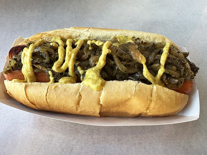 Not just any hot dog&mdash;this beauty comes loaded with caramelized onions and mustard, proving simplicity can be spectacular.