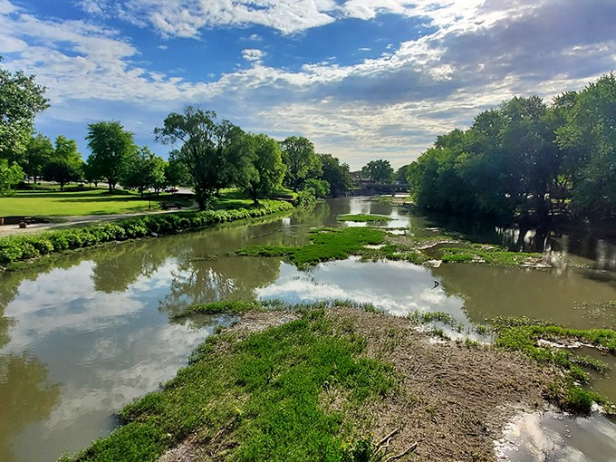 The Vermilion River creates nature's mirror, reflecting Midwestern skies so perfectly you'll wonder which way is up after your third coffee of the day.