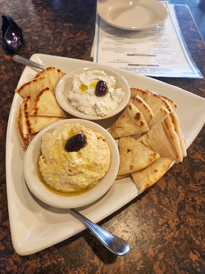 The hummus and tzatziki duo&mdash;creamy, garlicky ambassadors of Greek cuisine that make raw vegetables suddenly worth the trip to the table.