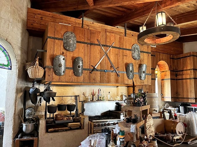 The castle kitchen where medieval meets modern &ndash; those hanging shields probably don't help with the cooking, but they look impressive!