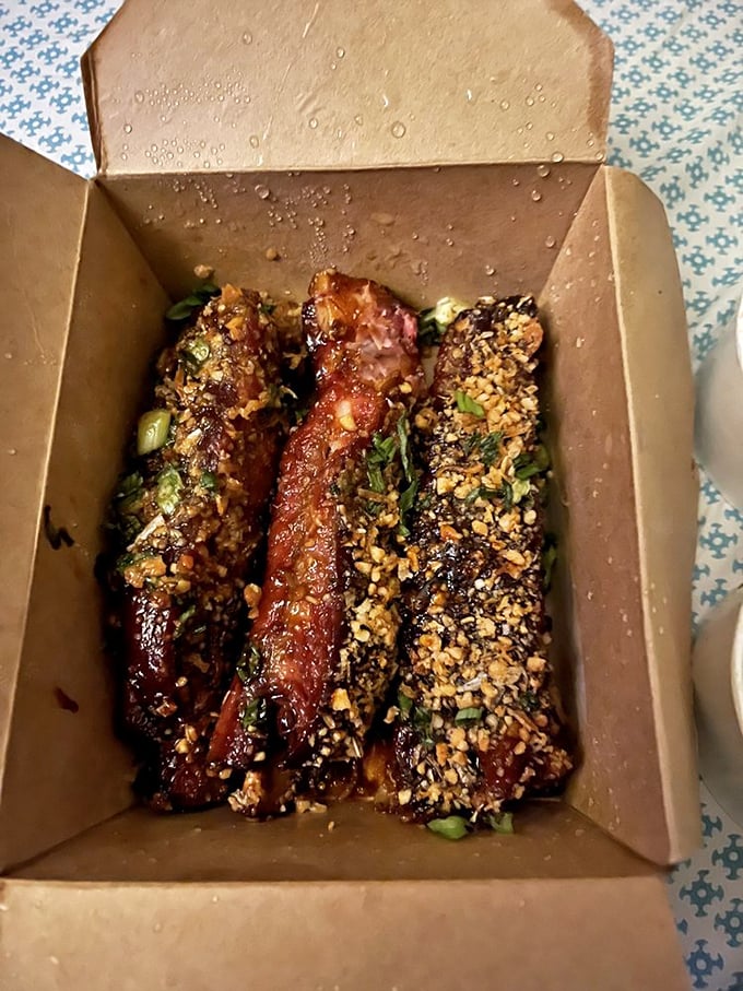 A trio of ribs garnished with scallions and sesame seeds&mdash;proof that barbecue is the universal language of deliciousness.