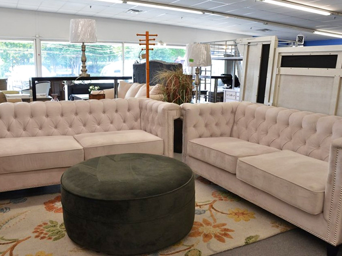 Elegant tufted sofas arranged like they're waiting for a Pottery Barn photoshoot. The only thing missing is the markup that would normally make you wince.