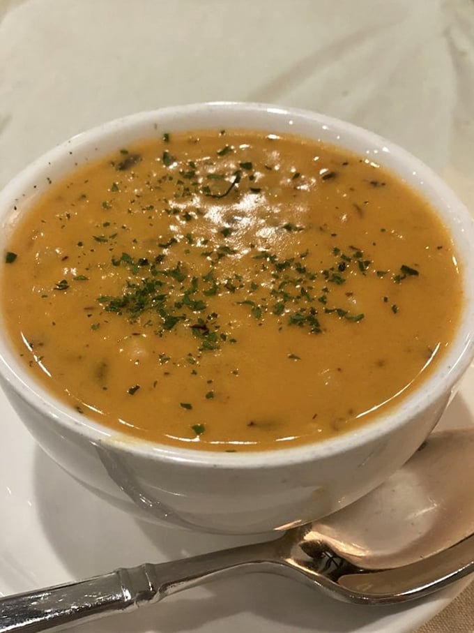 A bisque so velvety and rich it could run for office. The sprinkle of fresh herbs adds both color and a promise of flavor complexity.