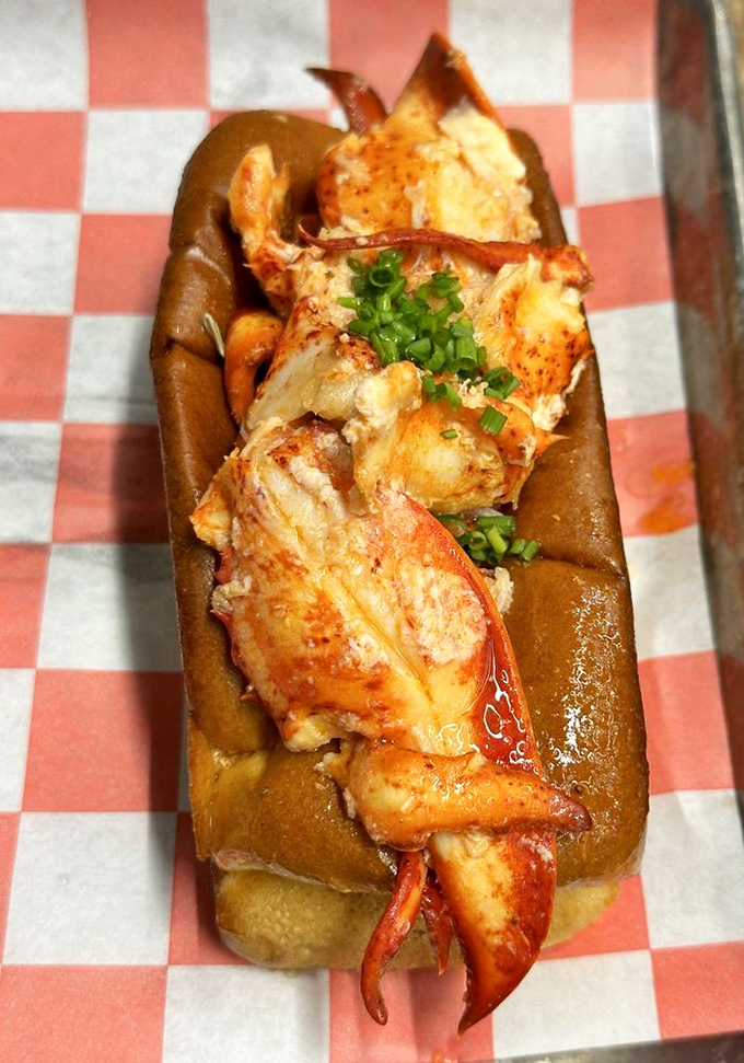 This lobster roll isn't playing around. It's the heavyweight champion of seafood sandwiches, spilling over with meat that was swimming mere hours ago.