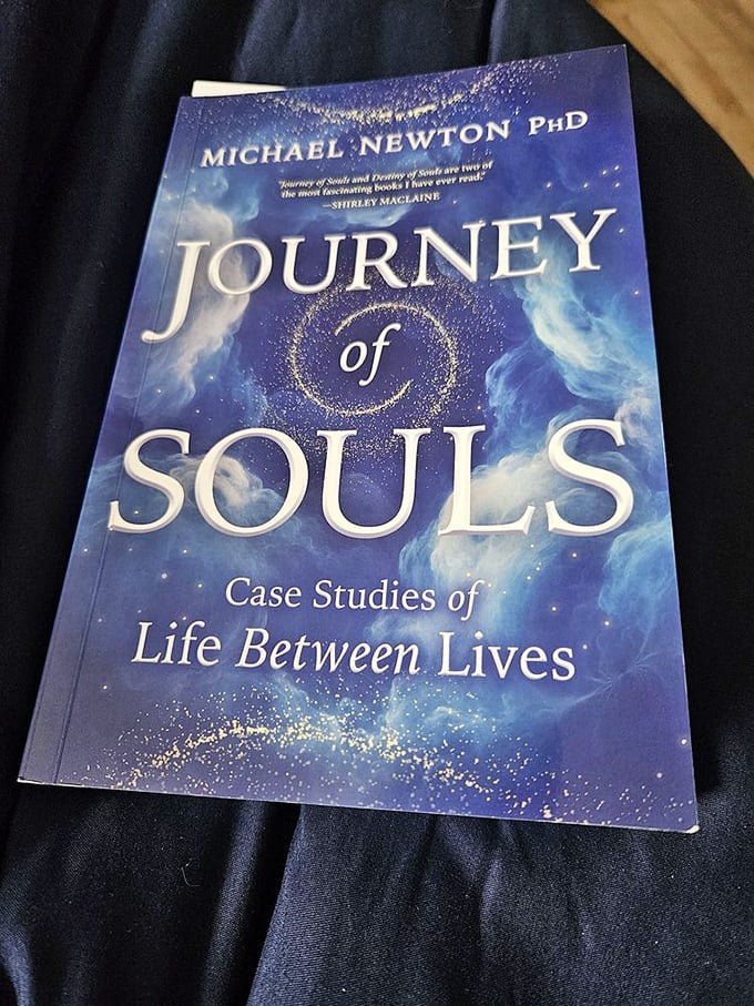 Michael Newton's "Journey of Souls" sits ready to transport curious minds beyond the physical realm—no passport required.