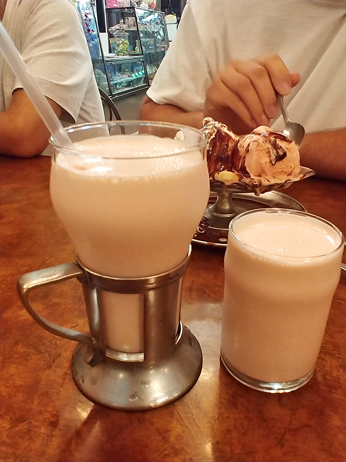 Those frothy milkshakes arrive like liquid dreams, thick enough to require some serious straw commitment.