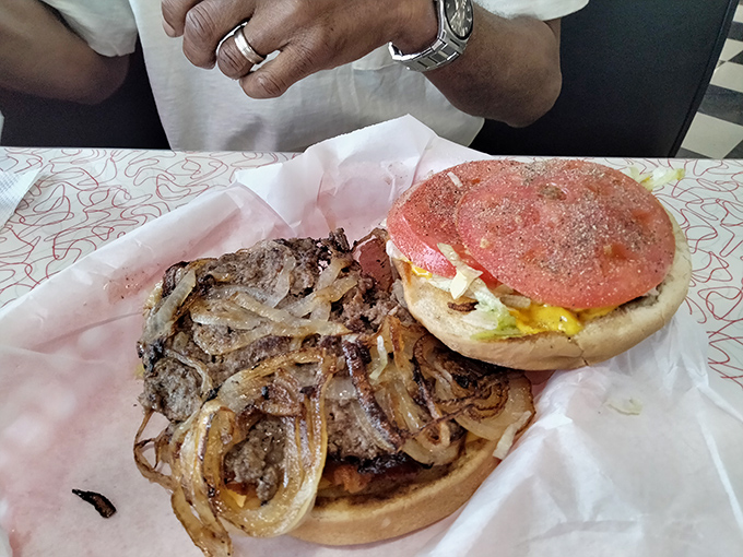 The legendary onion burger in its natural habitat. Those onions aren't just grilled—they've become one with the beef in a beautiful marriage.