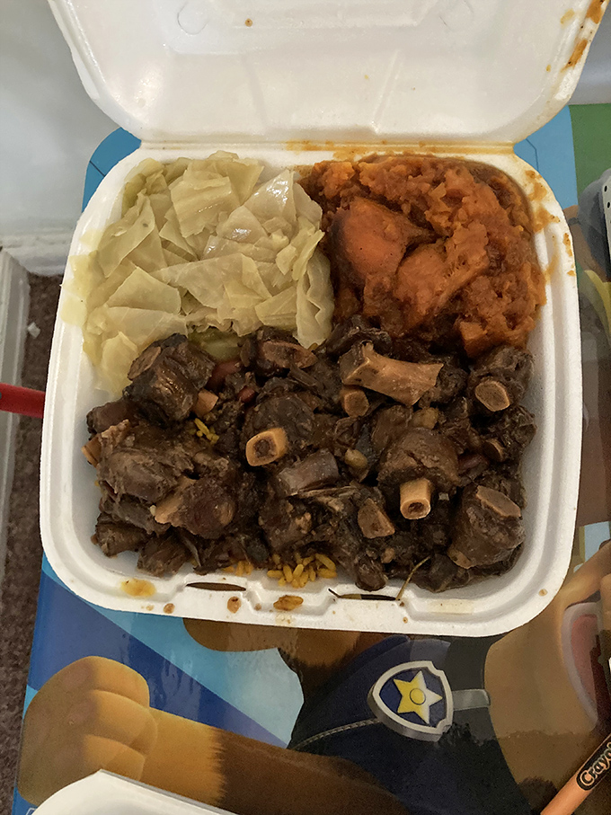 Tender oxtails that have clearly been simmering since yesterday, with cabbage and sweet potatoes completing this soul food trifecta.