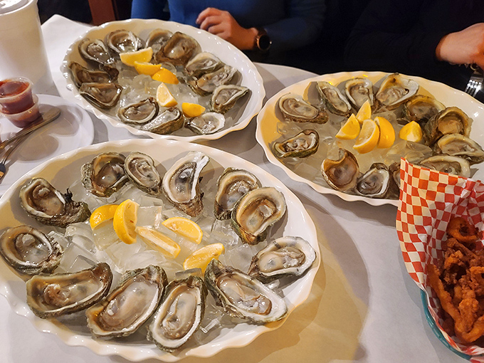 Fresh oysters on ice with bright lemon wedges&mdash;nature's perfect appetizer. The ocean's most elegant calling card.