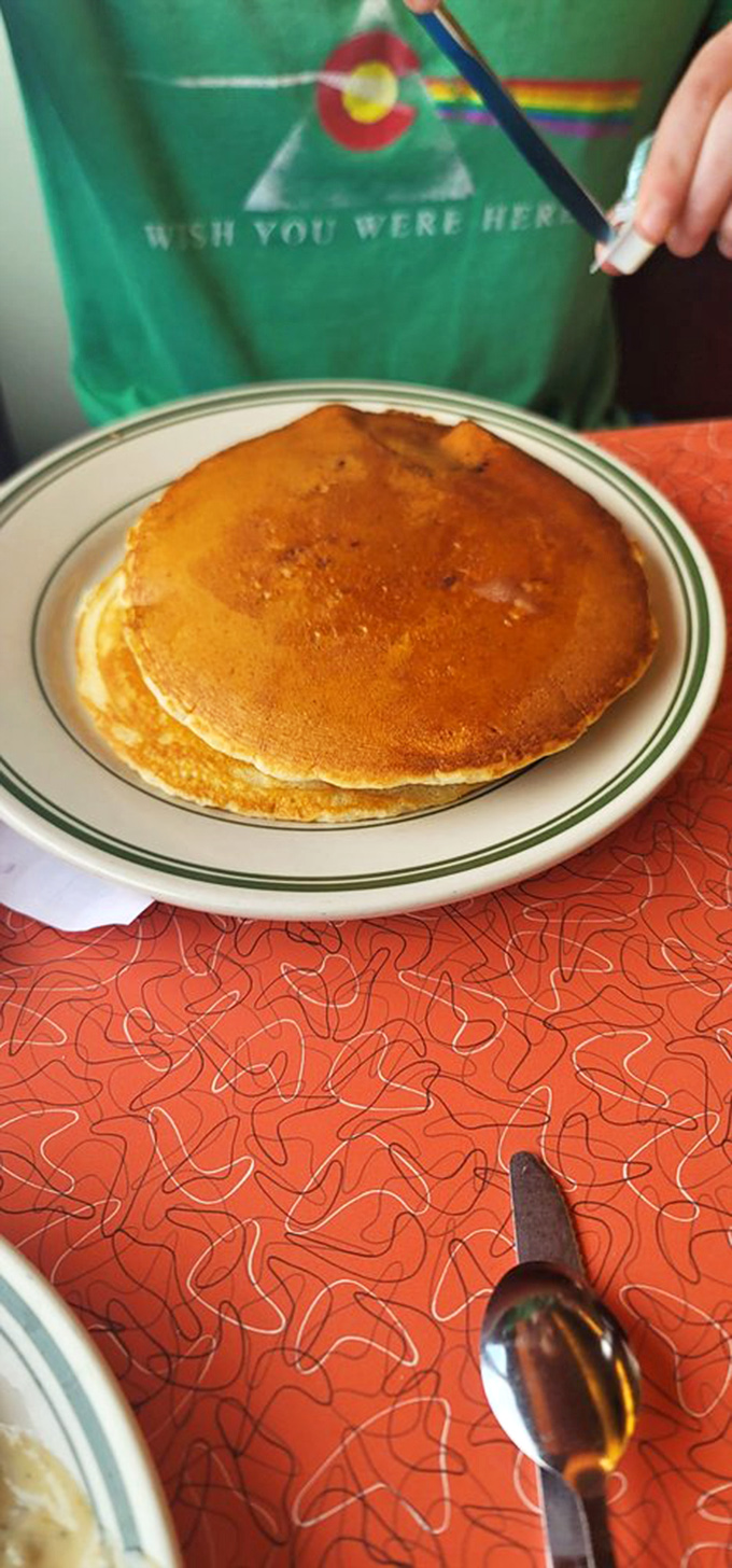 Pancakes so golden they deserve their own Fort Knox. Perfectly round, perfectly browned, and waiting for that ceremonial first cut.