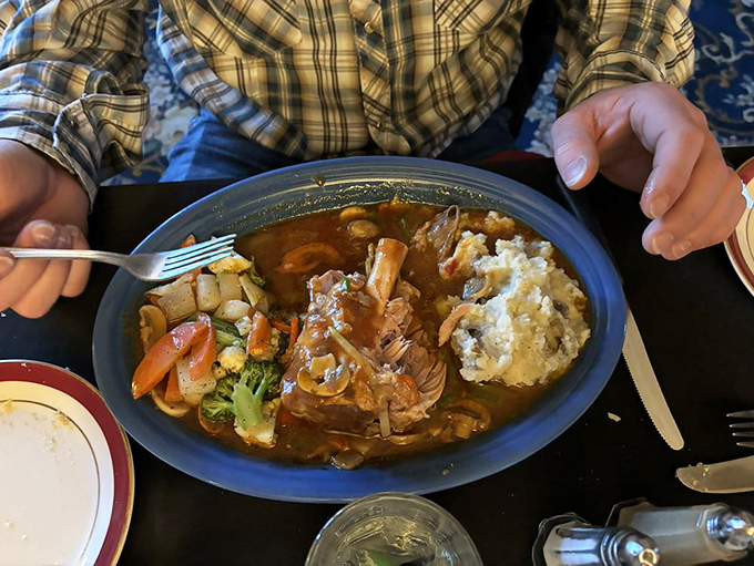The pork shank doesn't just fall off the bone&mdash;it practically jumps onto your fork. Swimming in rich sauce with a side of mashed potatoes for gravy-soaking duty.
