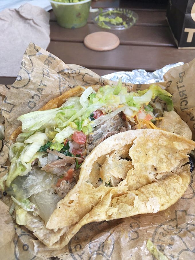 Pork carnitas nestled in a warm tortilla with all the fixings&mdash;proof that sometimes the simplest pleasures are the most profound. 