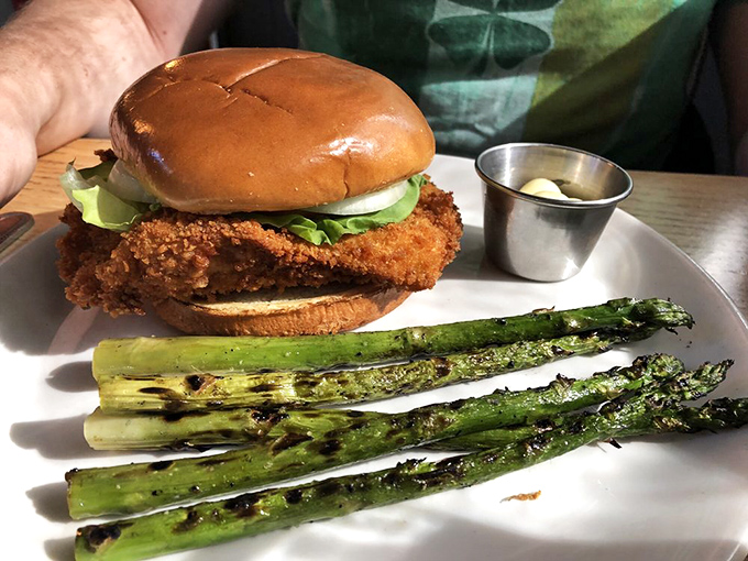 Indiana's famous pork tenderloin, where the meat-to-bun ratio suggests someone's playing a delicious practical joke on bread.
