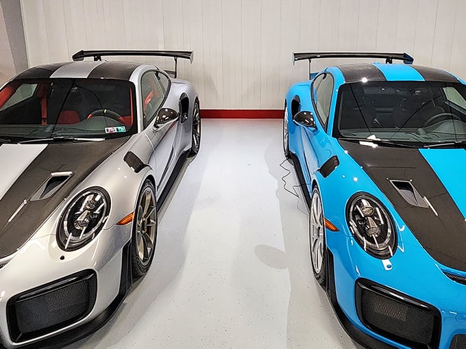 These Porsches sit side by side like perfectly matched bookends, their racing-inspired wings suggesting they might take flight if you blink too long.