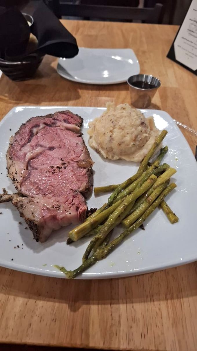 Prime rib so perfectly rosy it deserves its own Instagram account, accompanied by asparagus that actually makes you want to eat your vegetables.