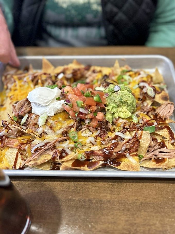 Nachos reimagined by barbecue royalty. When pulled pork meets tortilla chips, with fresh guacamole playing matchmaker, everybody wins.