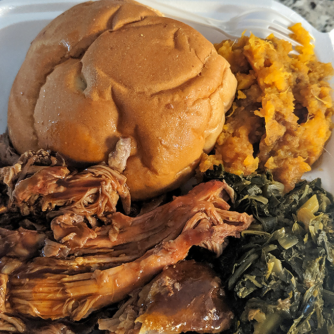 A proper pulled pork sandwich should require both hands and at least three napkins. This one demands a whole roll.