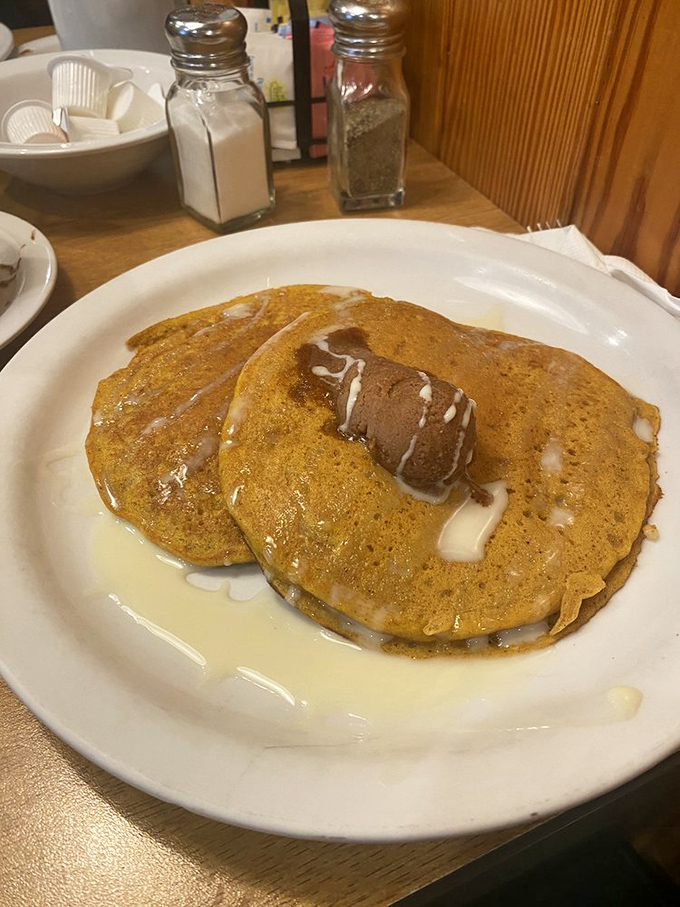 Pumpkin pancakes with a melting pat of butter&mdash;autumn's greatest gift to breakfast, available year-round for those who refuse to be bound by seasonal rules.
