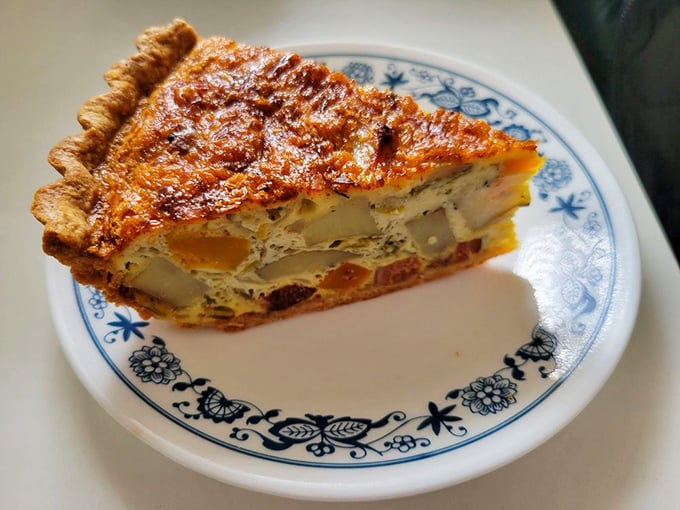 This quiche doesn't play games. It's the kind of serious breakfast commitment that makes hitting the snooze button seem like a crime.