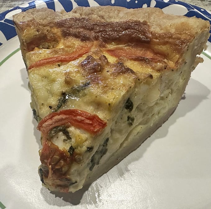 Savory pie architecture at its finest&mdash;layers of ingredients creating the skyscraper of quiche your breakfast dreams deserve.