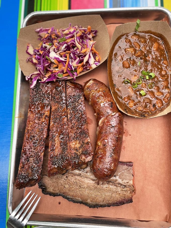 Brisket, sausage, and beans&mdash;the holy trinity of Texas BBQ. That coleslaw isn't just a side, it's the palate cleanser between bites of smoky heaven.