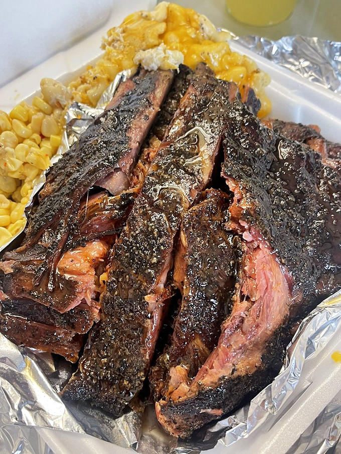 Ribs with a smoke ring so perfect it belongs in a barbecue museum, paired with mac and cheese that's unapologetically decadent.