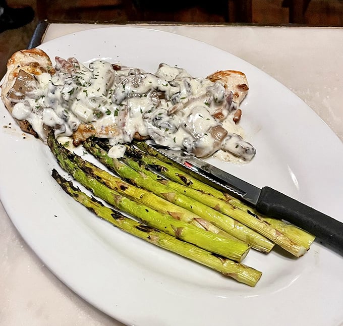 Tender chicken nestled against grilled asparagus—proof that McGarvey's isn't just a one-trick pony in the seafood-centric Annapolis dining scene.
