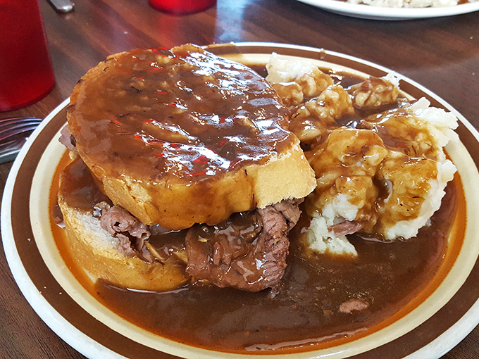 This hot roast beef sandwich doesn't just satisfy hunger&mdash;it abolishes it. The gravy-soaked bread and tender meat create a comfort food masterpiece.