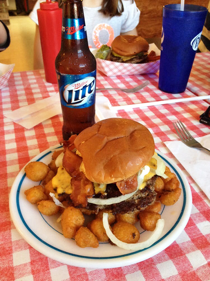 The Miller Lite isn't just a beverage choice—it's a statement that some traditions, like this loaded bacon cheeseburger, need no improvement.