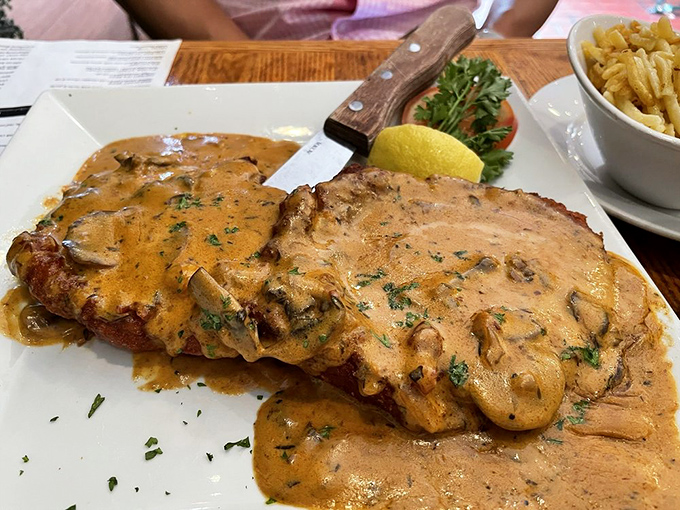 Schnitzel that demands your respect. Those mushrooms aren't just lounging in cream sauce &ndash; they're creating a flavor symphony worth every calorie.