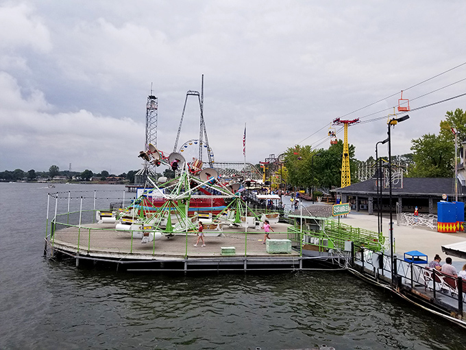 The colorful balloon ride offers a gentler thrill for those who prefer their memories without screaming. Note the wooden coaster frame photobombing in the background.