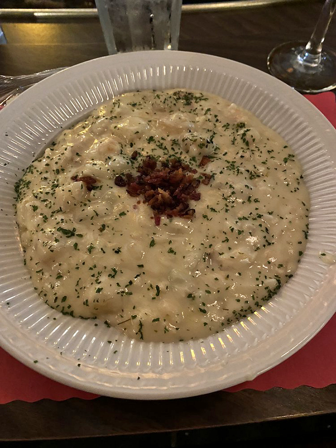 This isn't just seafood chowder&mdash;it's a creamy ocean symphony topped with crispy bacon bits. Spoons up, conversation paused.