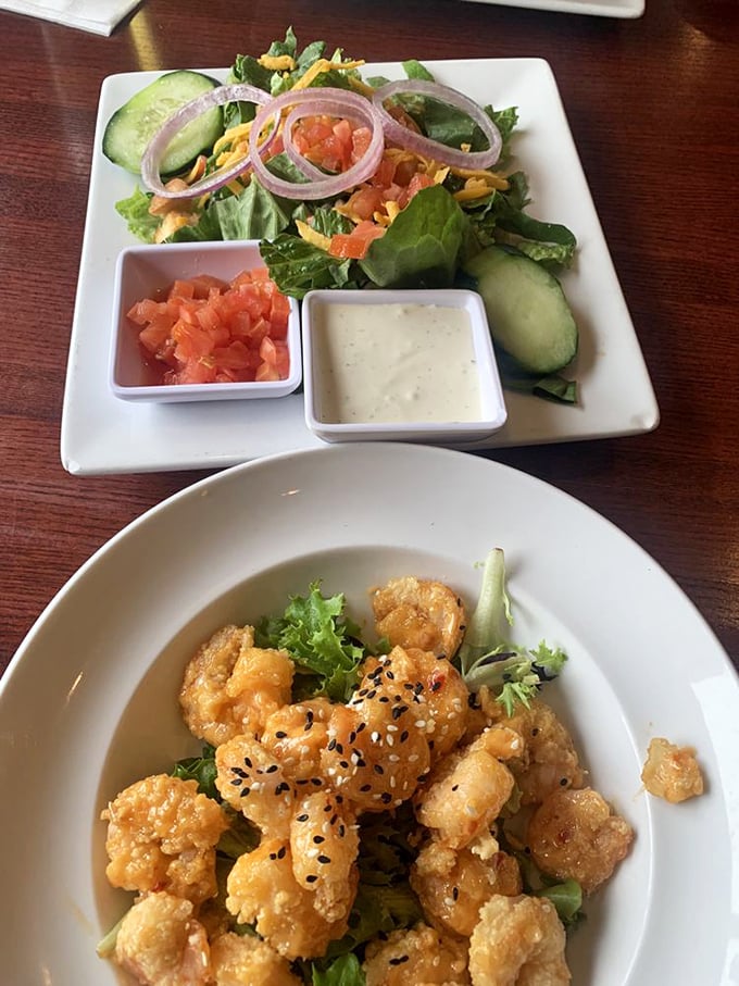 Fresh greens playing supporting role to crispy, golden shrimp&mdash;a duo that proves vegetables and fried food can peacefully coexist.