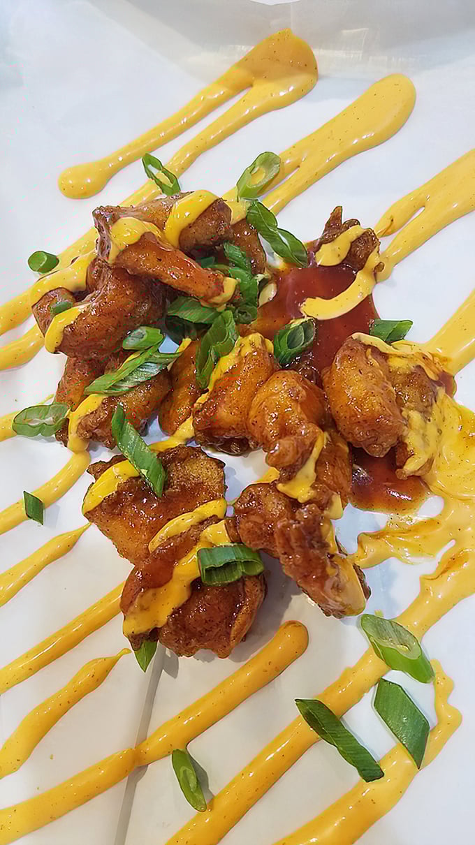 These wings, artfully dressed in sauce and green onions, prove that barbecue joints can plate food with the finesse of their white-tablecloth cousins.