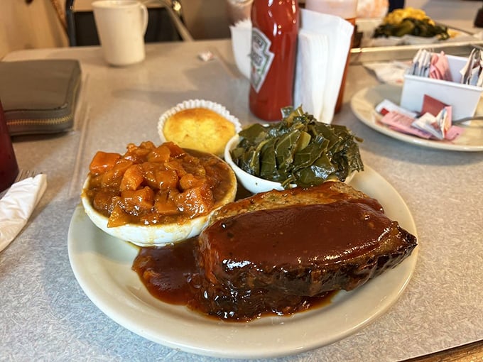 That glistening meatloaf demands respect. Paired with those collards and yams, it's the comfort food trifecta.