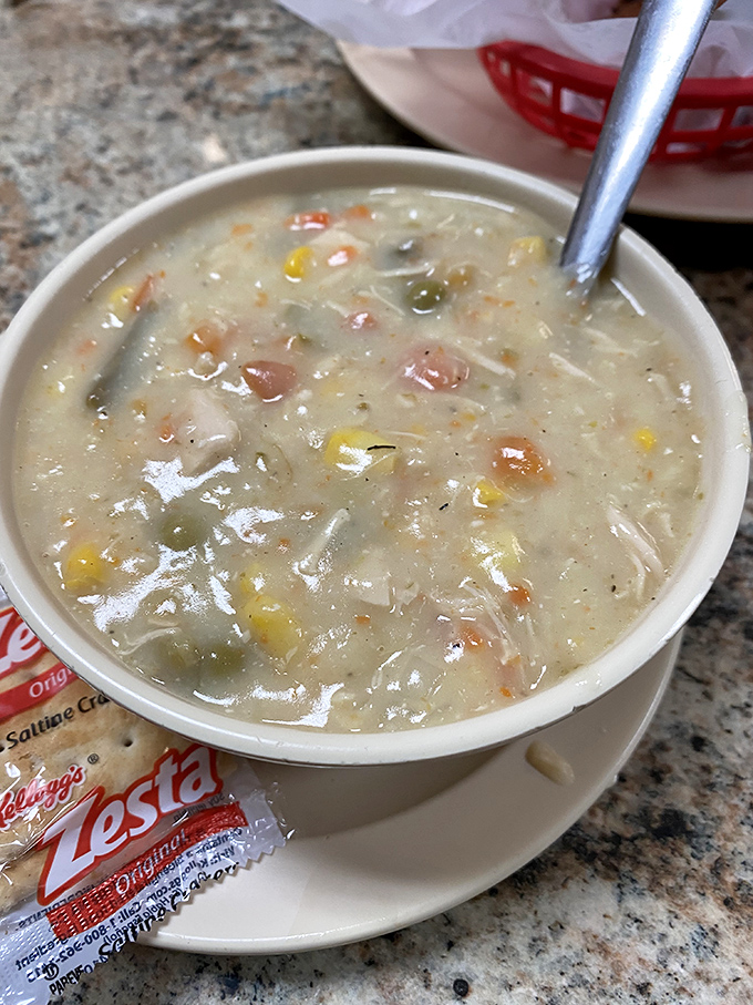 A bowl of homemade soup that whispers, "Don't worry, everything's going to be okay." Chunks of chicken and vegetables swimming in liquid comfort.