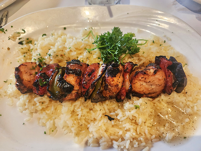 Souvlaki over rice: Meat candy on a stick that would make Zeus himself put down his thunderbolt for a bite.