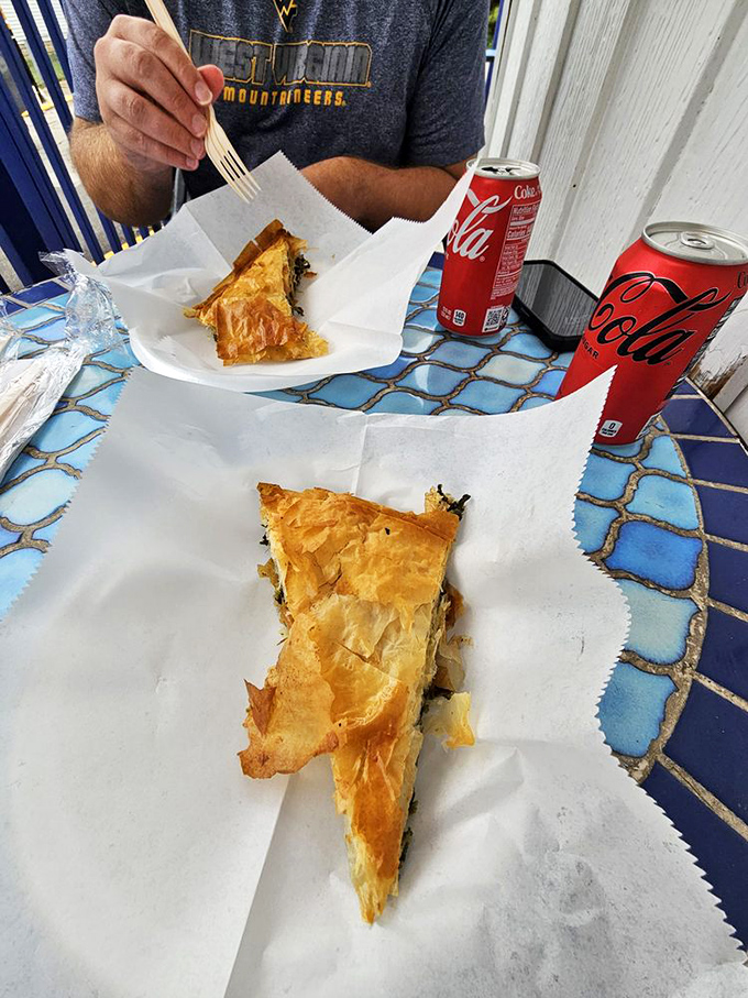 Flaky, golden spanakopita that shatters with each bite. Spinach and feta wrapped in phyllo—simple math that equals pure delight.
