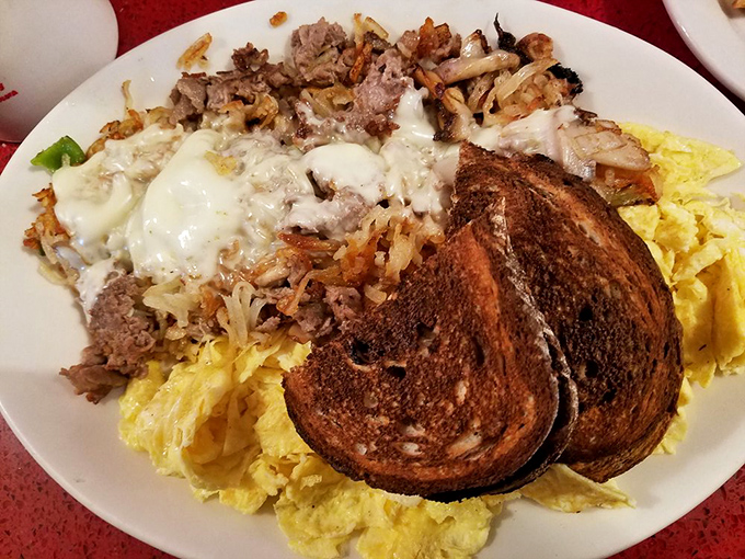 This breakfast beast combines steak, eggs, and those legendary hash browns into one glorious skillet. The toast is just there for structural support.