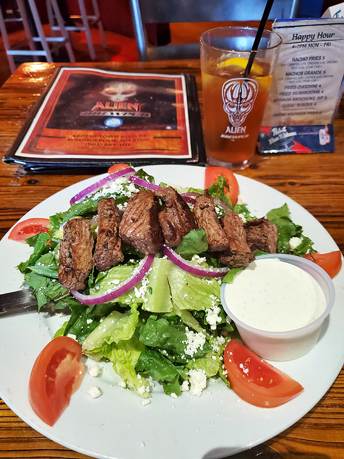 Who knew aliens appreciated a good steak salad? Perfectly grilled beef atop fresh greens with feta and vibrant veggies creates a meal that's both satisfying and colorful.