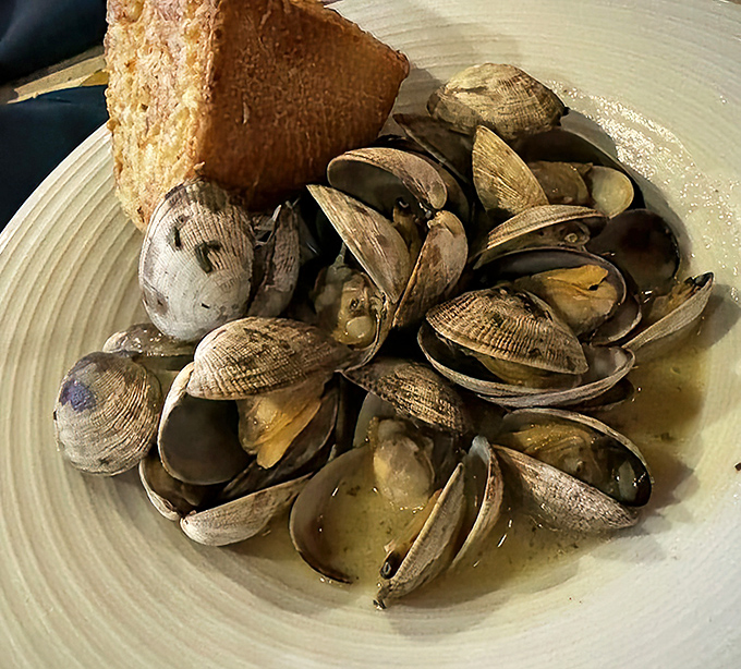 These steamed clams have opened up to reveal their secrets&mdash;tender morsels bathing in a broth you'll want to soak up with every crumb of bread.