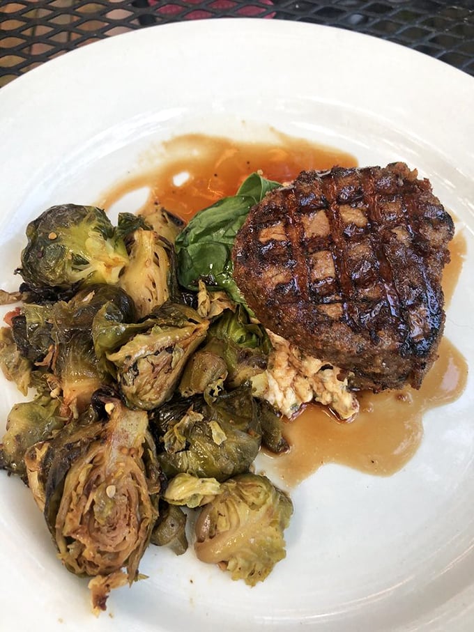 The Stuffed Filet Mignon arrives like royalty with a crown of Brussels sprouts, making you question why you ever wasted time eating anywhere else.