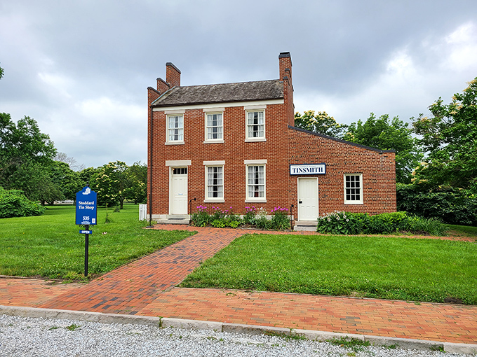 This immaculately preserved tinsmith shop looks ready for business, its red brick exterior and symmetrical windows a testament to 19th-century craftsmanship.